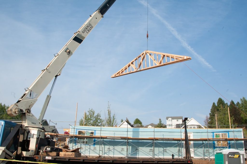 Lifting Truss onto the Roof - Palouse Habitat for Humanity